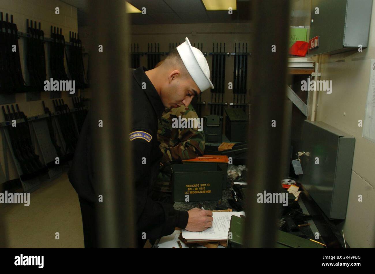 US Navy is issued ceremonial rifles at the base armory prior to ...