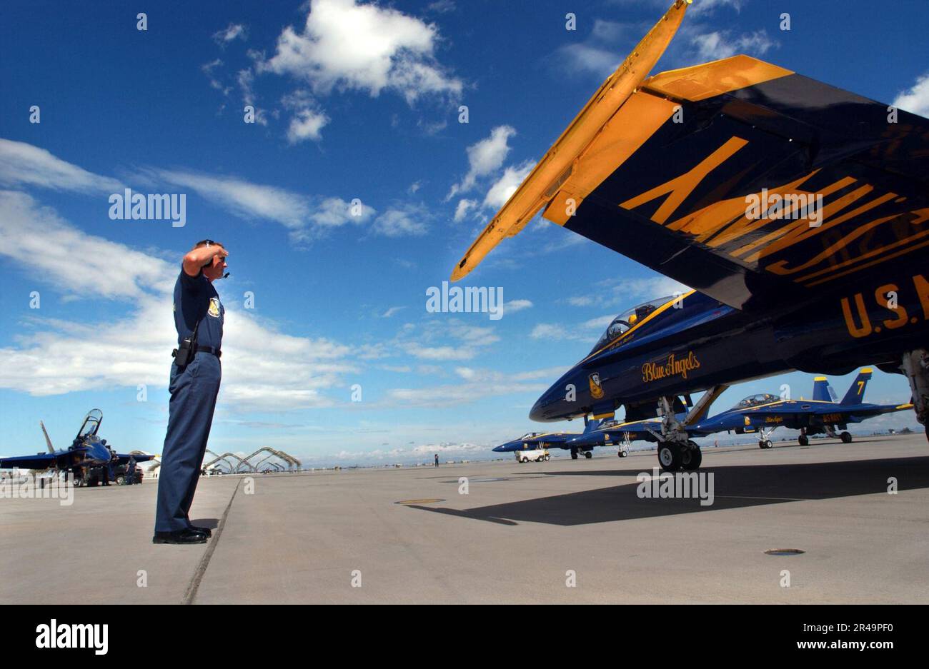 US Navy Aviation Structural Mechanic 1st Class renders a salute to the ...