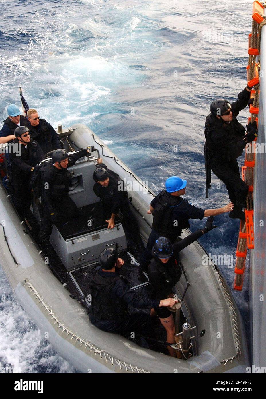 US Navy A member of the Vessel, Board, Search, and Seizure (VBSS) team ...
