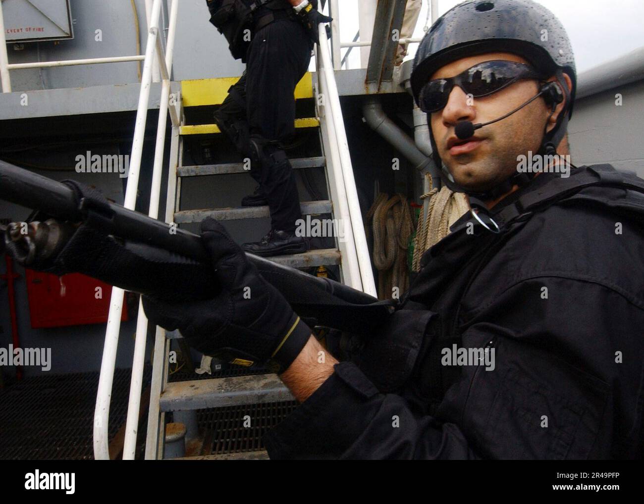 US Navy A member of the Vessel, Board, Search, and Seizure (VBSS) team ...