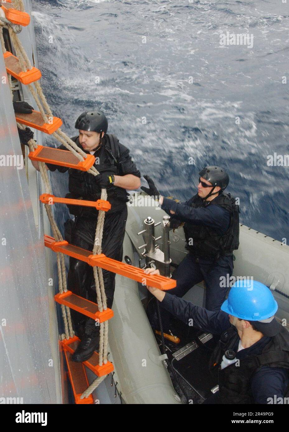 US Navy A member of the Vessel, Board, Search, and Seizure (VBSS) team ...