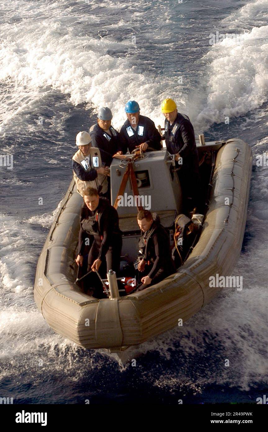 US Navy USS Kitty Hawk (CV 63) Sailors train aboard the Hull Inflatable ...