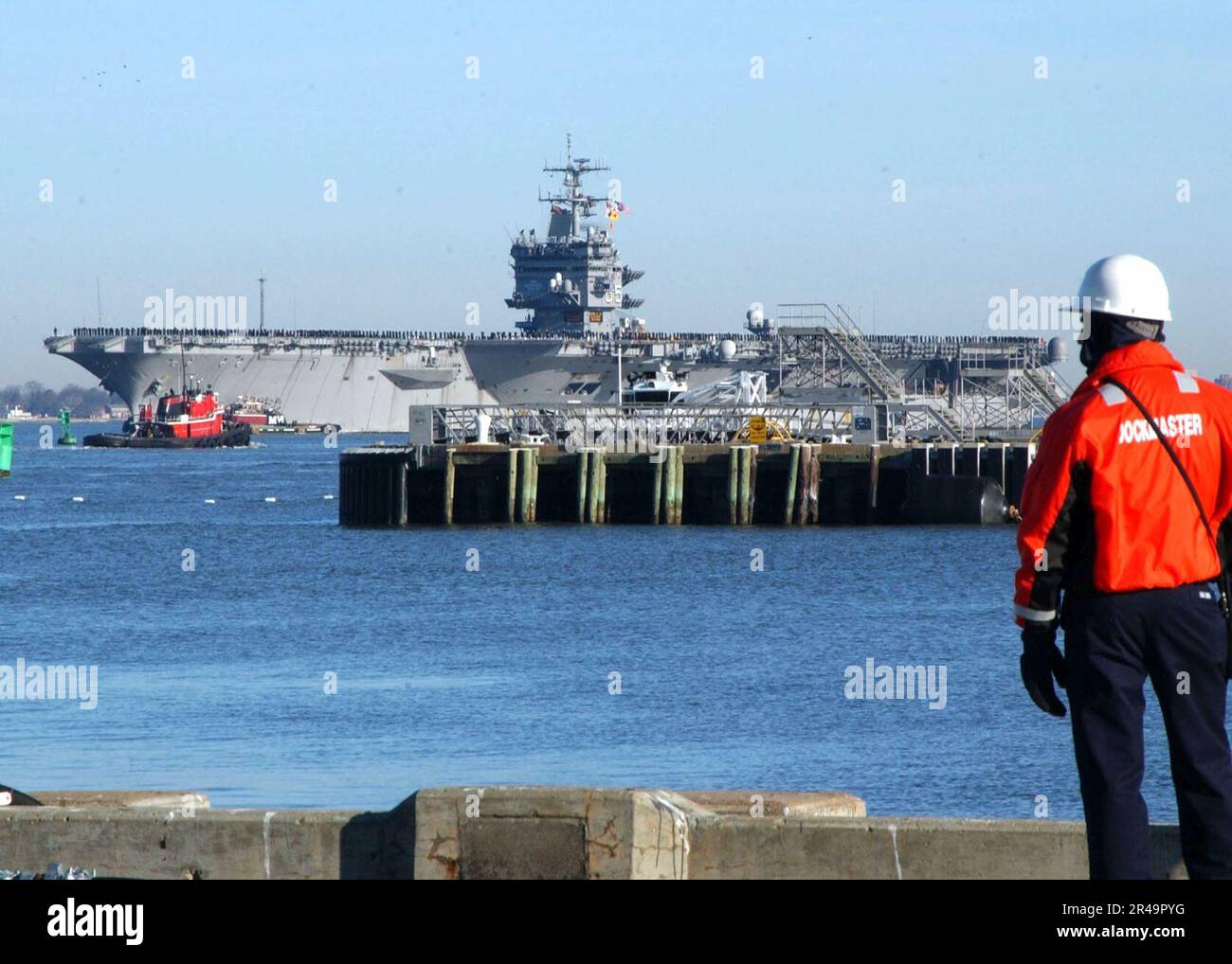 US Navy A dockmaster watches as the nuclear powered aircraft carrier ... US Navy A dockmaster watches as the nuclear powered aircraft carrier ...