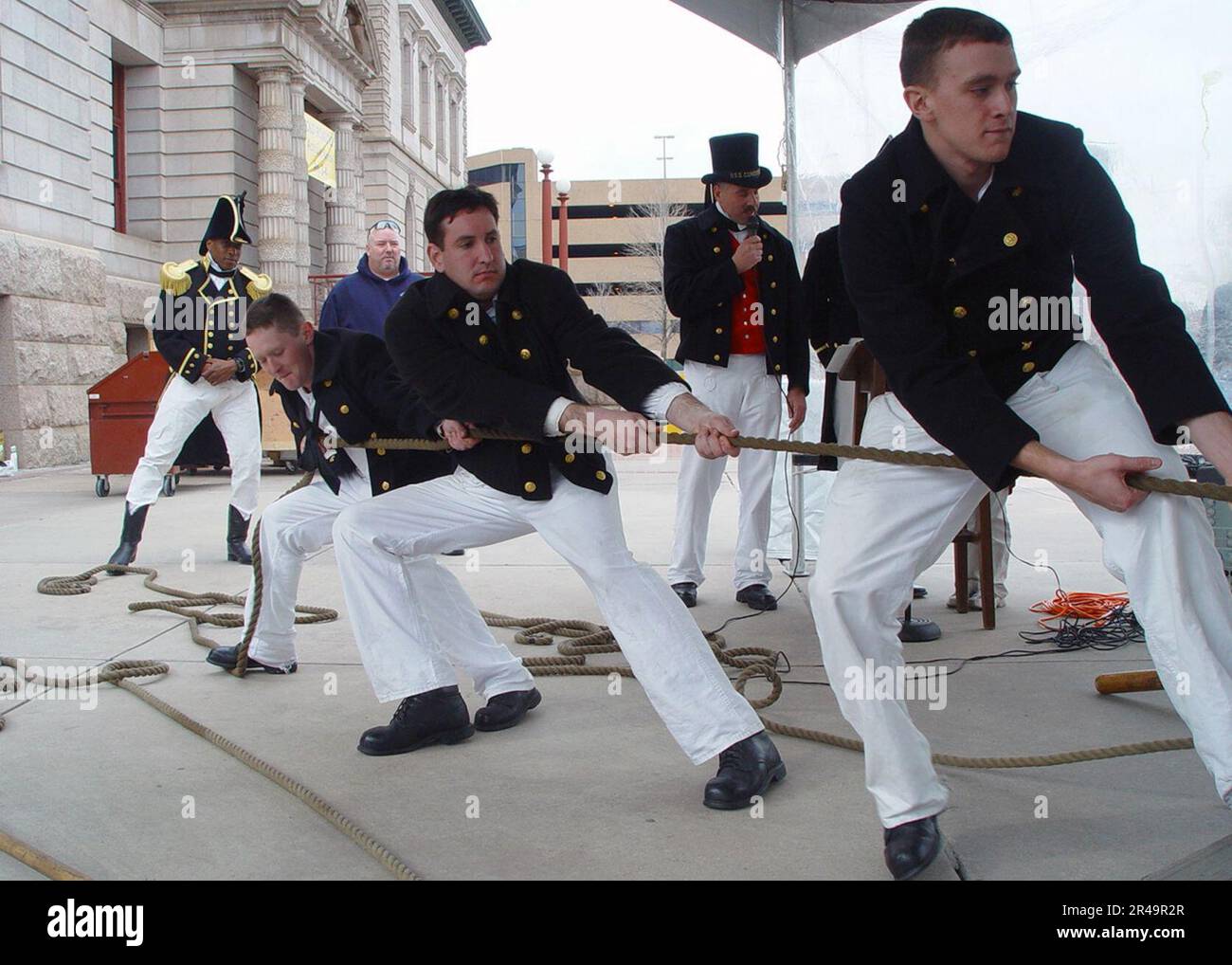 US Navy Seaman heave hard on a 5,600-pound, 1812-era Naval long gun ...