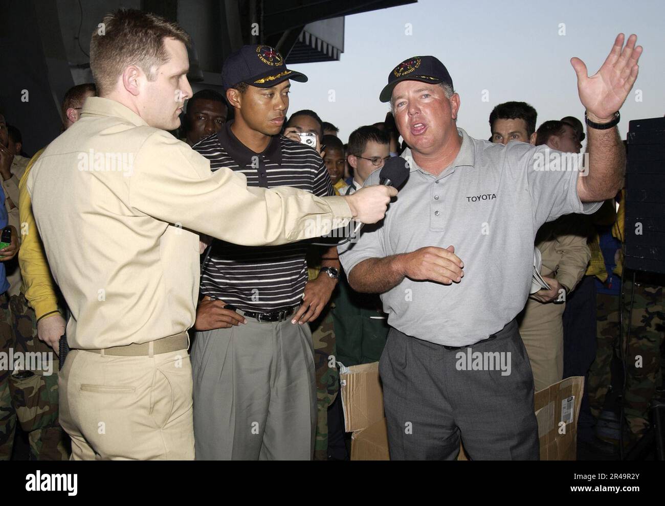 US Navy Professional golfers Tiger Woods and Mark O'Mara speak to the ...