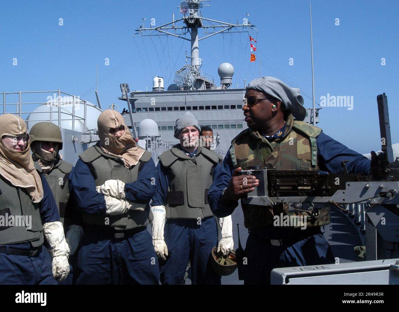 US Navy Gunner's Mate 1st Class instructs Sailors aboard the amphibious ...
