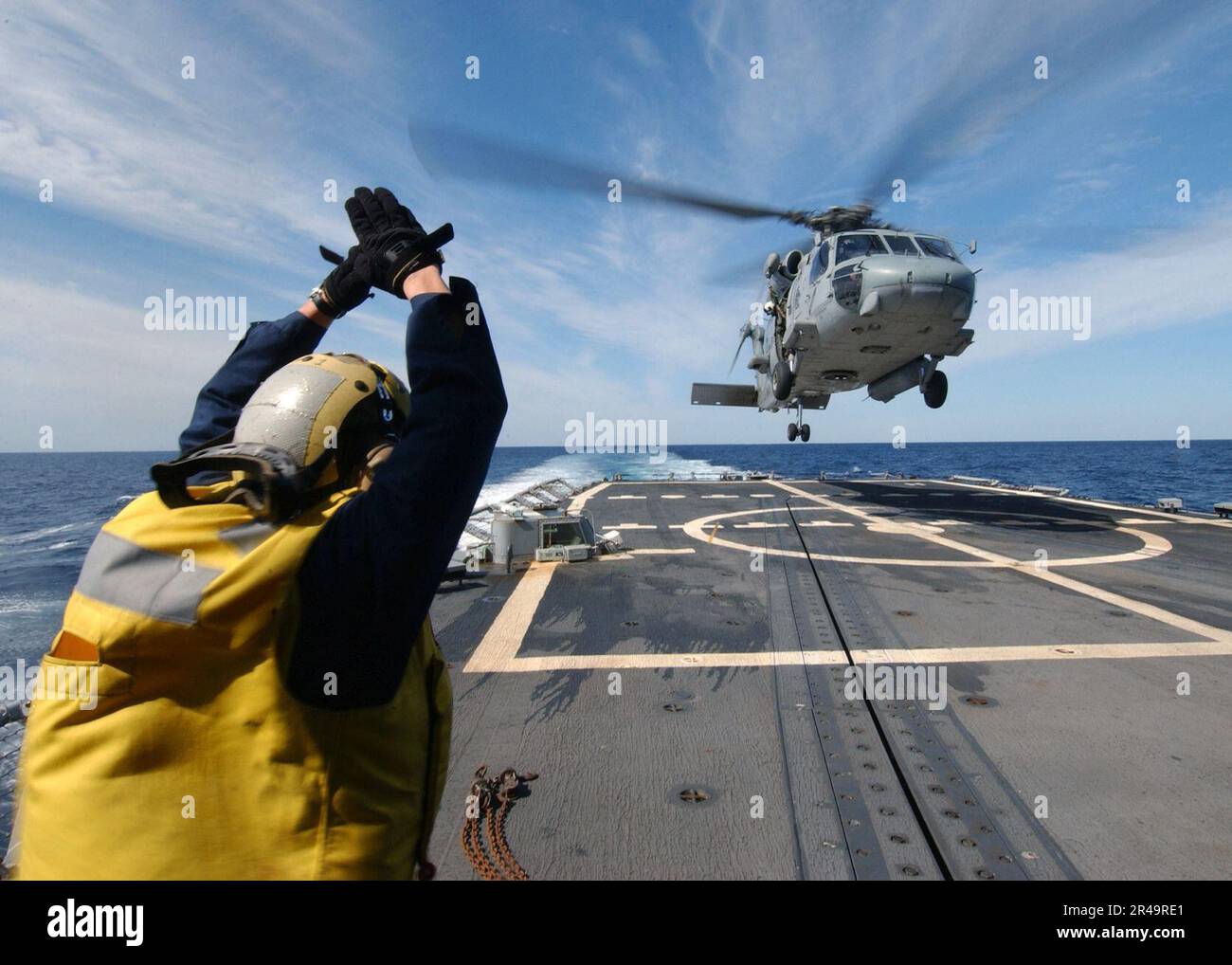US Navy A landing signal enlisted (LSE) assigned to the guided missile frigate USS Taylor (FFG ...