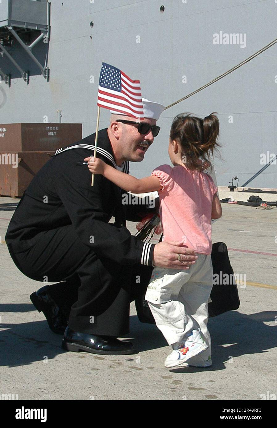 US Navy A Sailor gets an enthusiastic greeting after returning from a ...