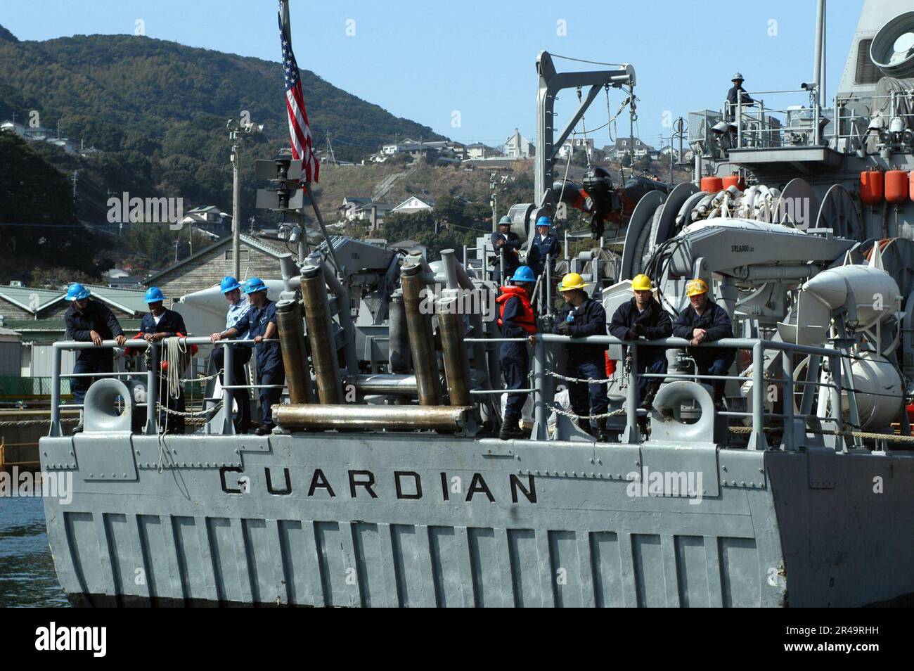 US Navy Sailors assigned to USS Guardian (MCM 5) stand by as the ship ...
