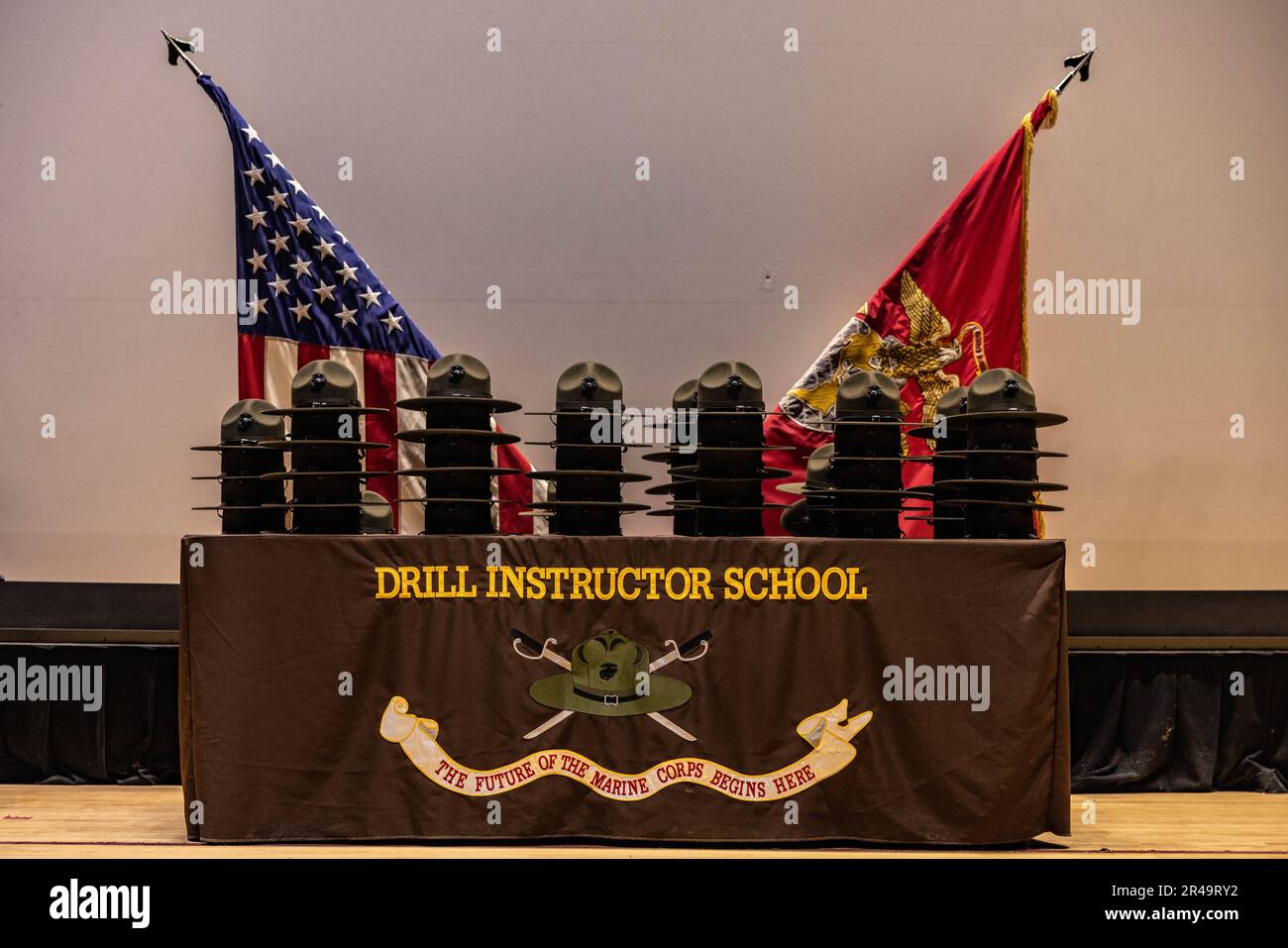 U.S. Marine Corps drill instructor campaign covers, sit on a table ...