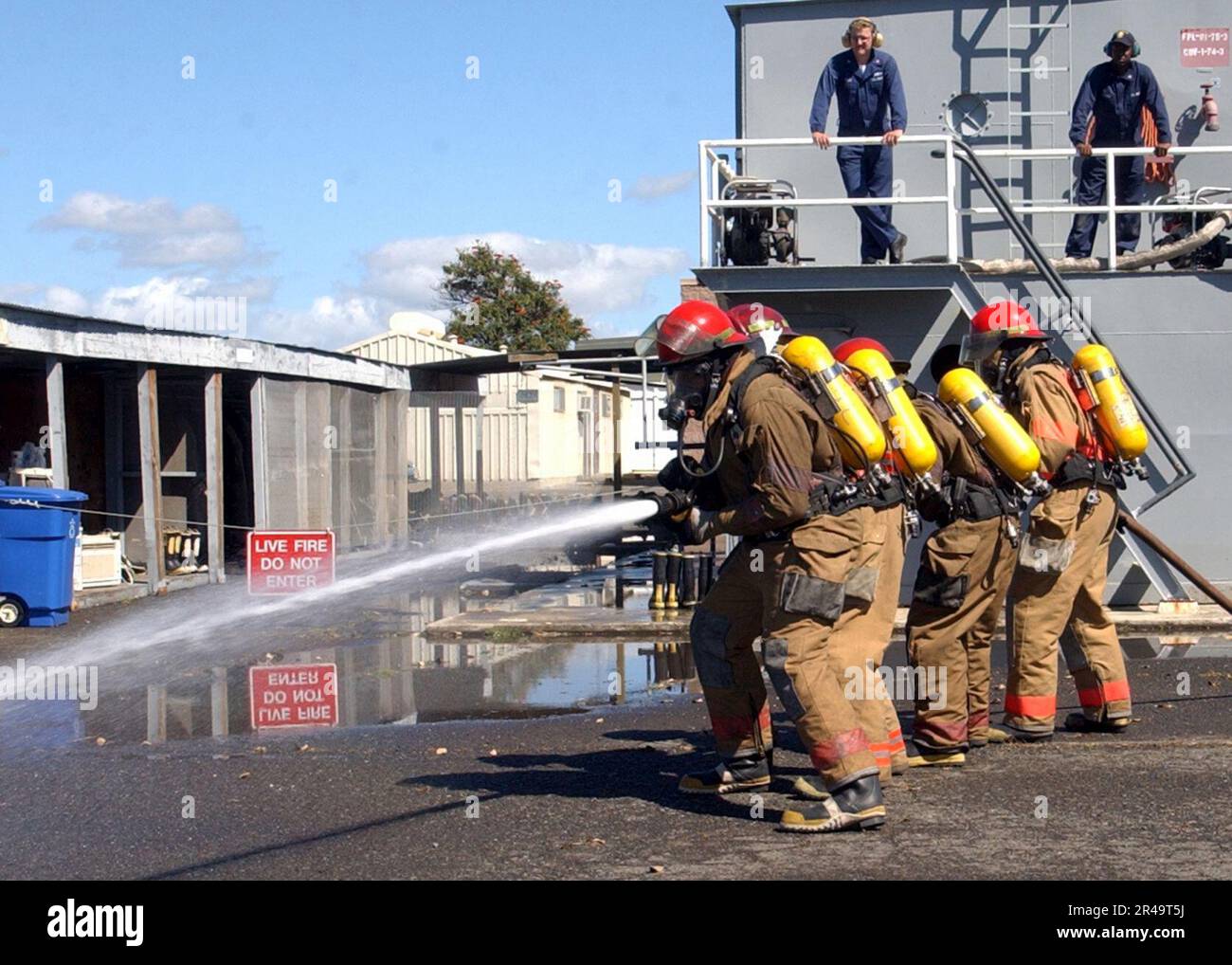 US Navy Sailors assigned to the guided missile cruiser USS Lake Erie ...