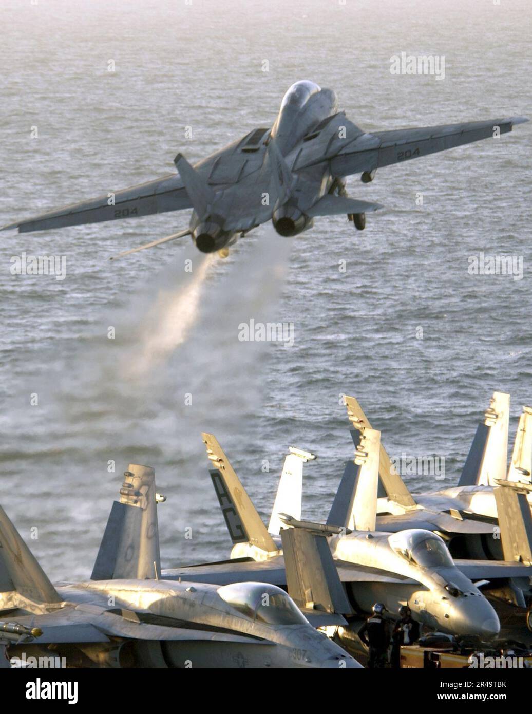 US Navy An F-14B Tomcat assigned to the Red Rippers of Fighter Squadron One One (VF-11) launches ...