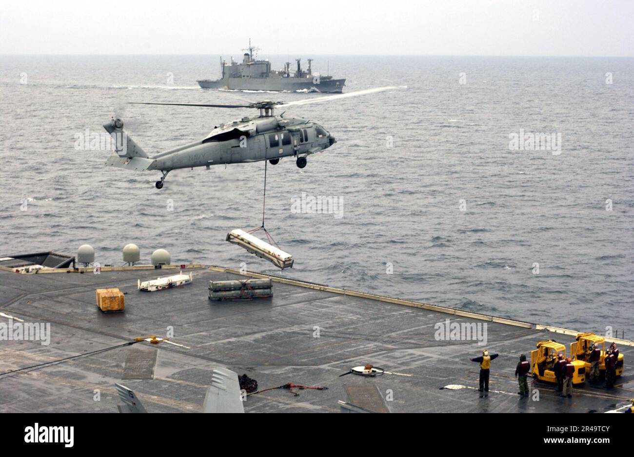 US Navy A MH-60S Knighthawk helicopter assigned to the Providers of ...