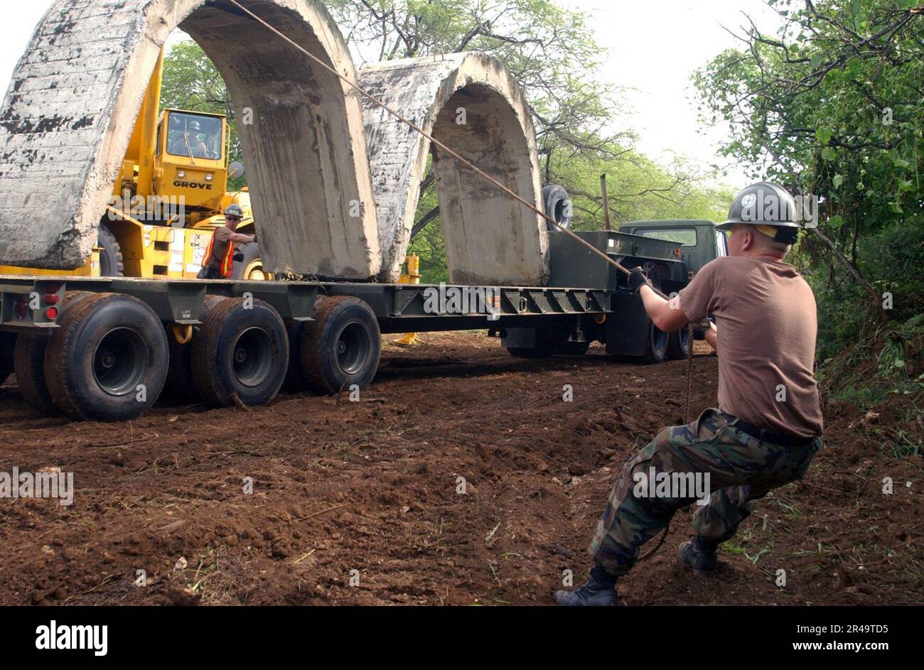 US Navy Equipment Operator Constructionman helps to refurbish the ...