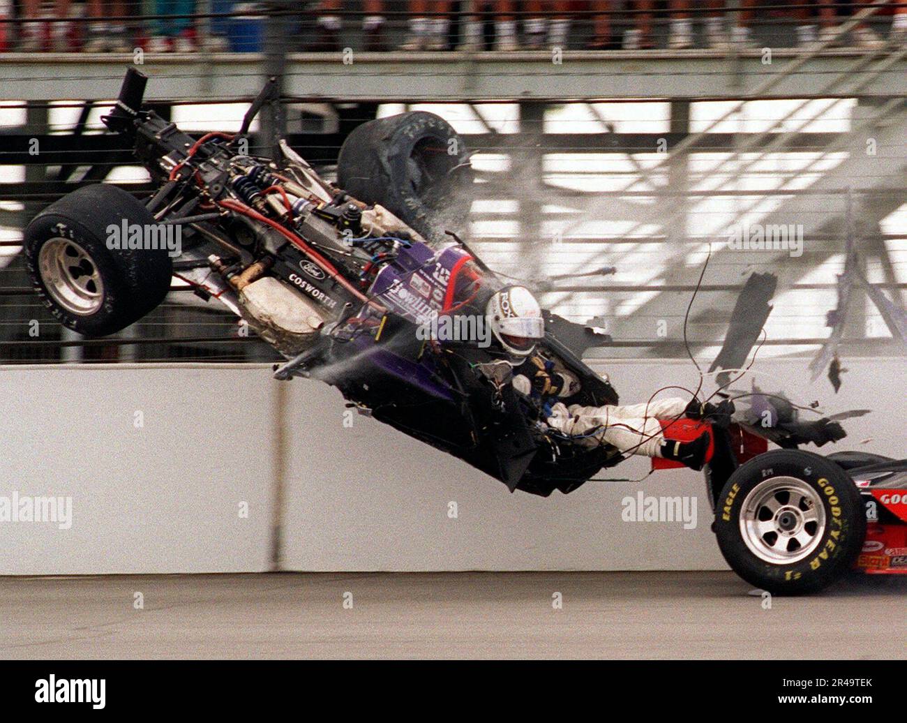 FILE - Stan Fox, his legs exposed, sits in his airborne car after the ...