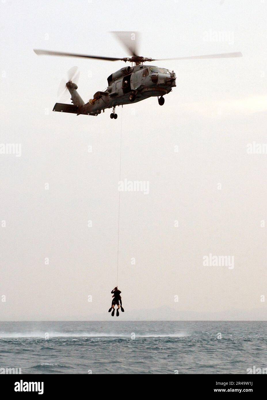 US Navy A Search and Rescue (SAR) swimmer assigned to the Warlords of ...