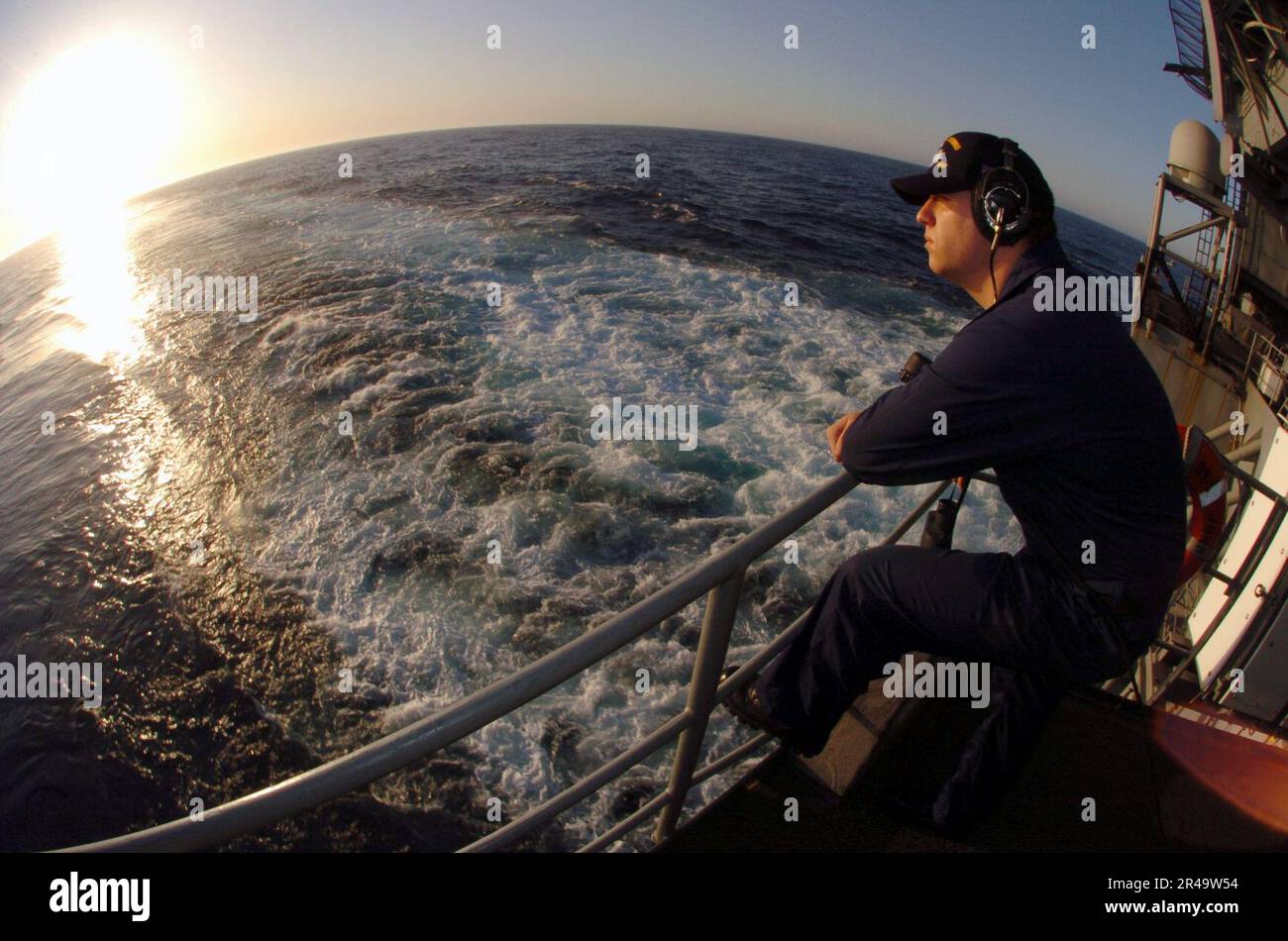 US Navy Seaman stands the Aft Lookout watch on the fantail aboard the ...