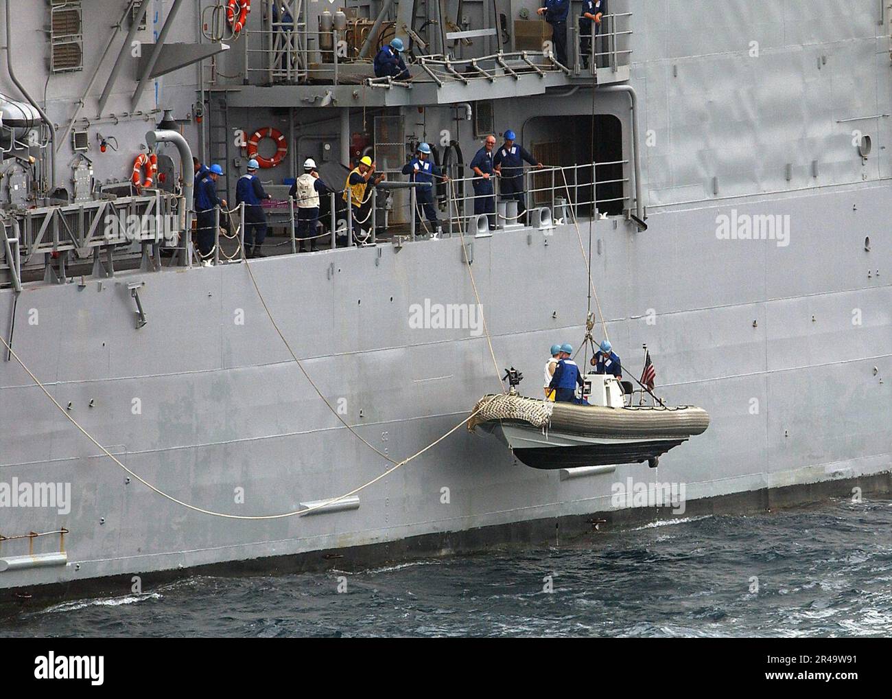 US Navy Crewmembers assigned to the guided missile cruiser USS Vella ...