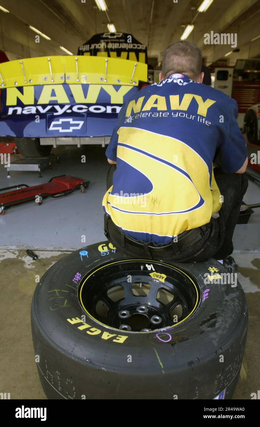 US Navy a mechanic on the Fitz-Bradshaw racing team, takes a break at the Texas Motor Speedway ...
