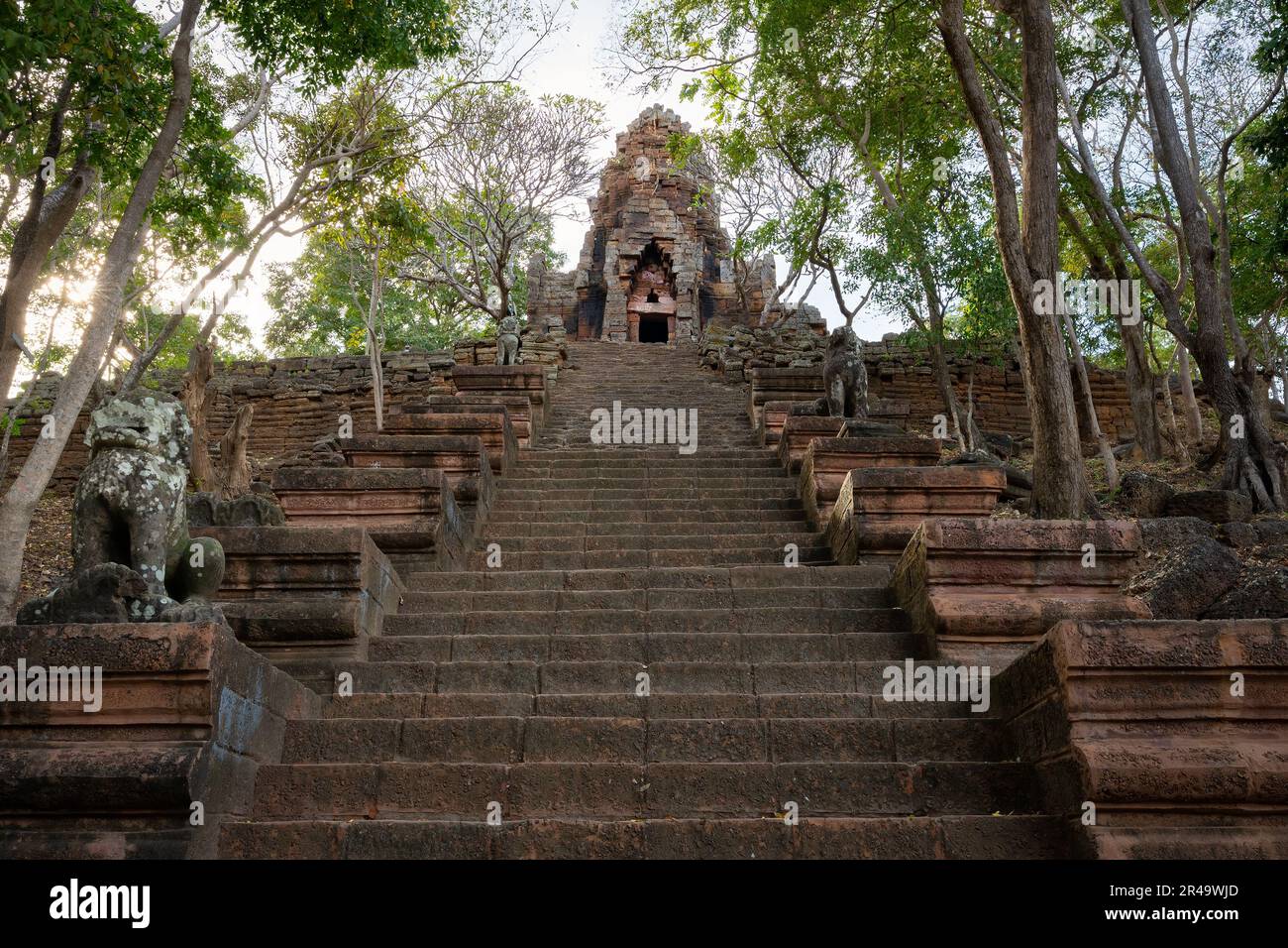 A view of Phnom Banan temple in Battambang, Cambodia surrounded by lush ...