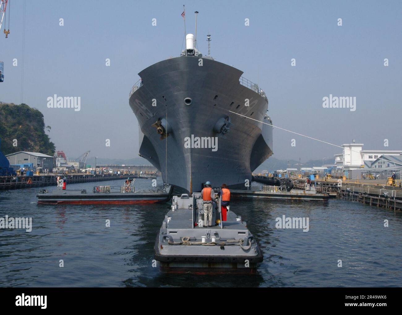 US Navy Small barges help to maneuver the 7th Fleet command and control ...