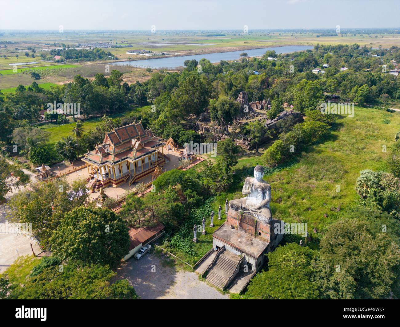 An aerial view of the Wat Ek Phnom Temple surrounded by lush greenery ...