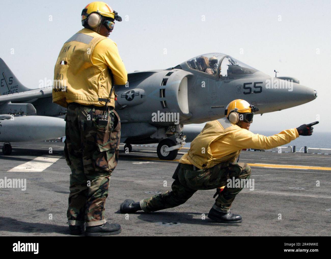 US Navy A plane director and shooter assigned to the amphibious assault ...