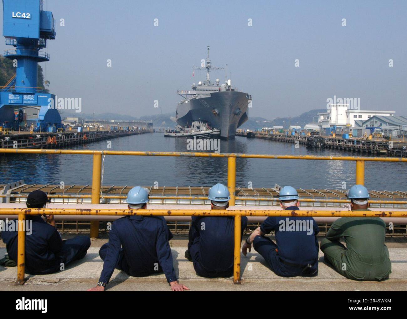 US Navy Crew members assigned to the 7th Fleet command and control ship ...