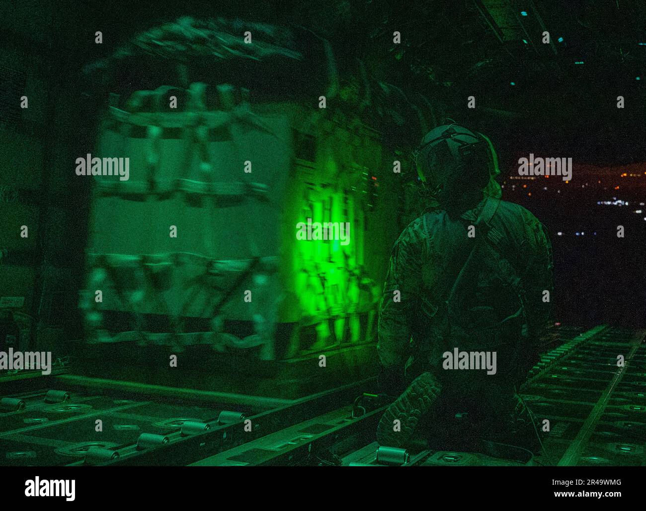 A U.S. Air Force HC-130J Combat King II aircraft drops airdrop pallets ...