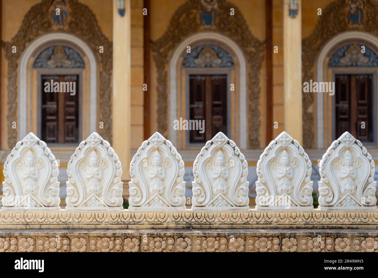 An ornate fence in front of the Wat Kandal Buddhist temple in ...
