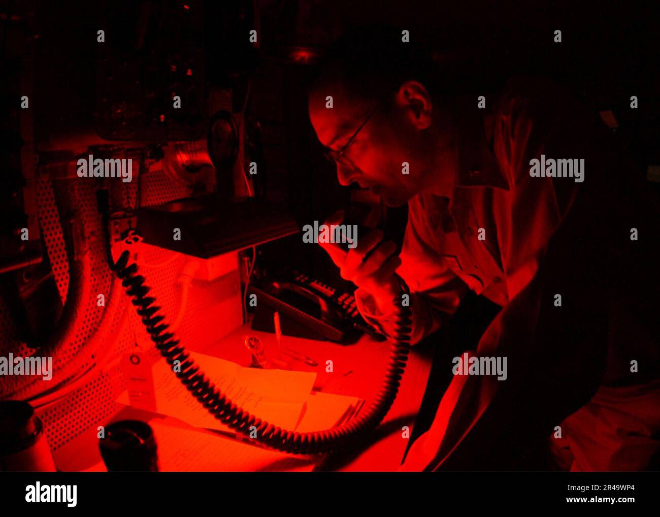 US Navy Command Chaplain, delivers the evening prayer to the ship's ...