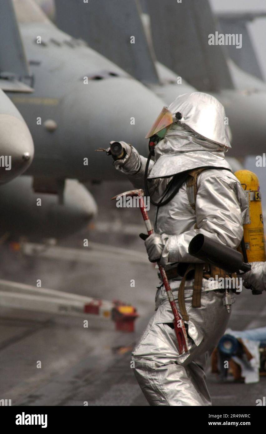 US Navy A crash and salvage crew member moves-in to overhaul a ...