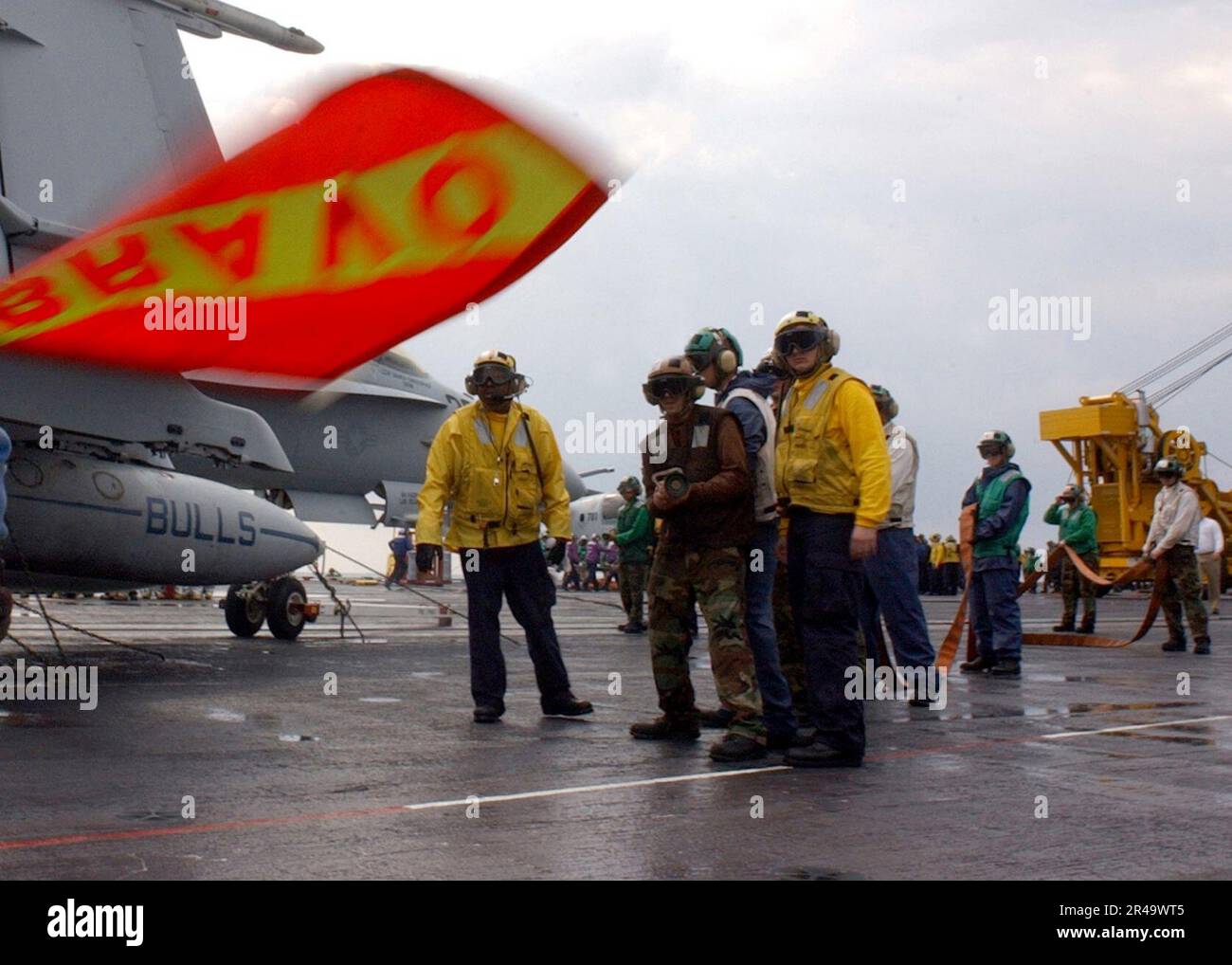 US Navy Flight Deck personnel simulate fighting a Class Bravo fire on ...