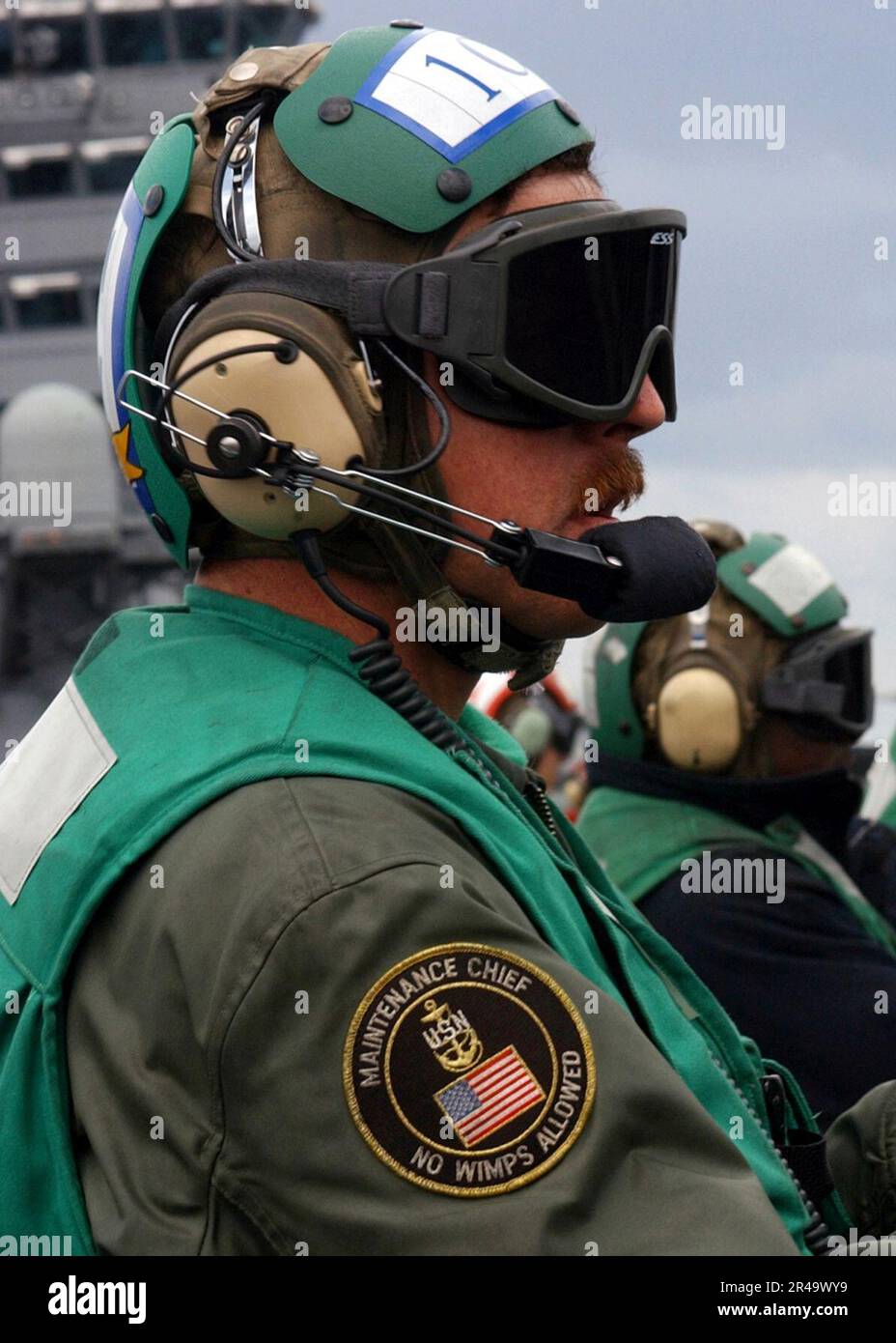 US Navy Chief Aviation Structural Mechanic watches as an F-14B Tomcat ...