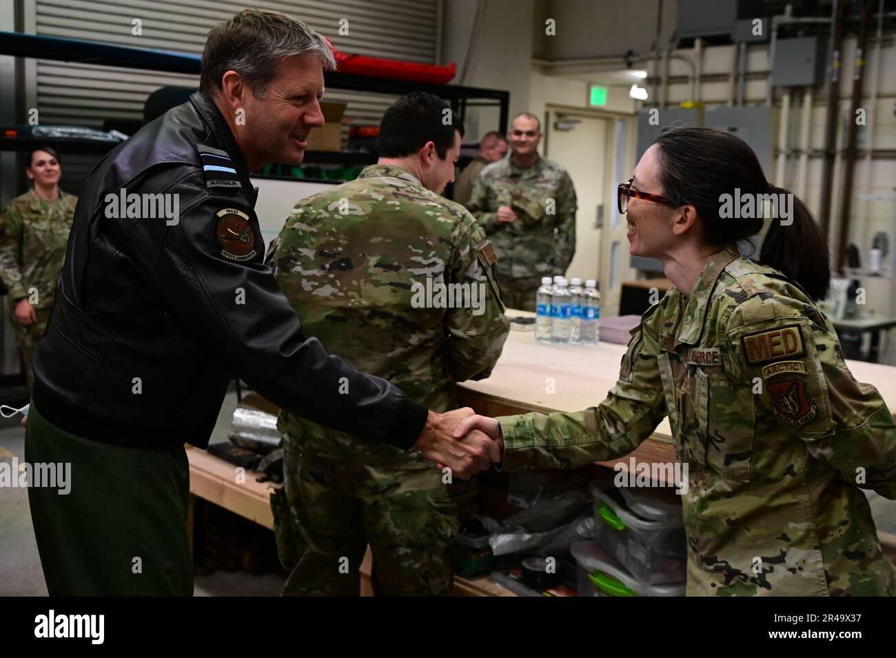 U.S. Air Force Lt. Col. Samantha Fil, Arctic Spark volunteer, shakes hands with Royal Australian ...