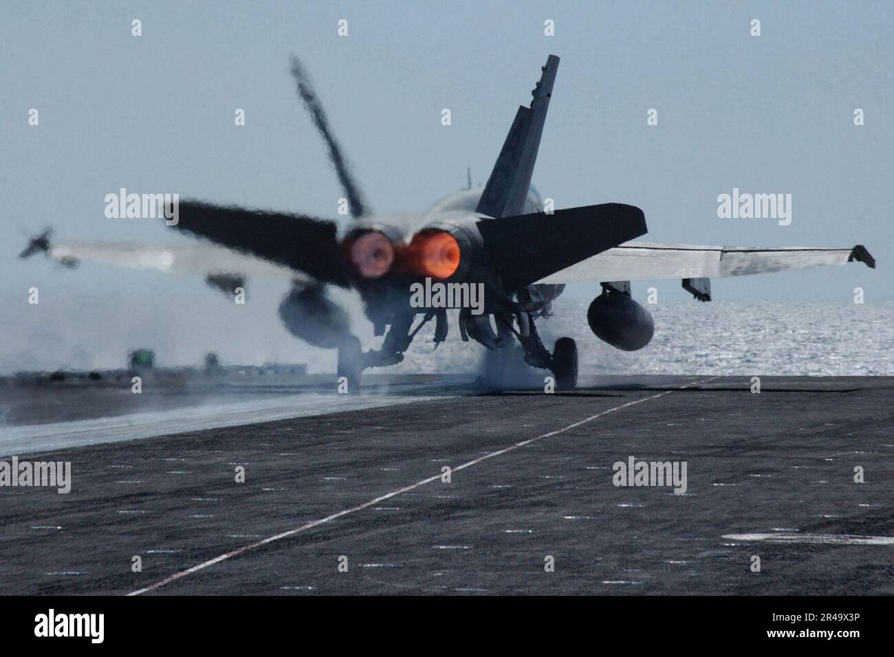 US Navy An F-A-18C Hornet launches from one of four steam powered ...