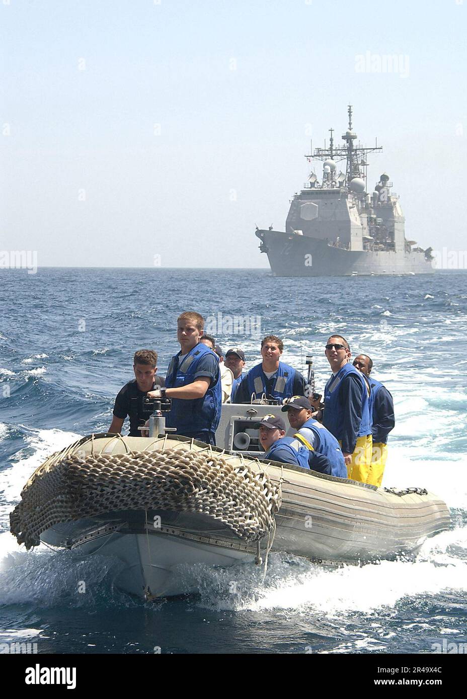 US Navy Crewmembers assigned to the guided missile cruiser USS Vella ...