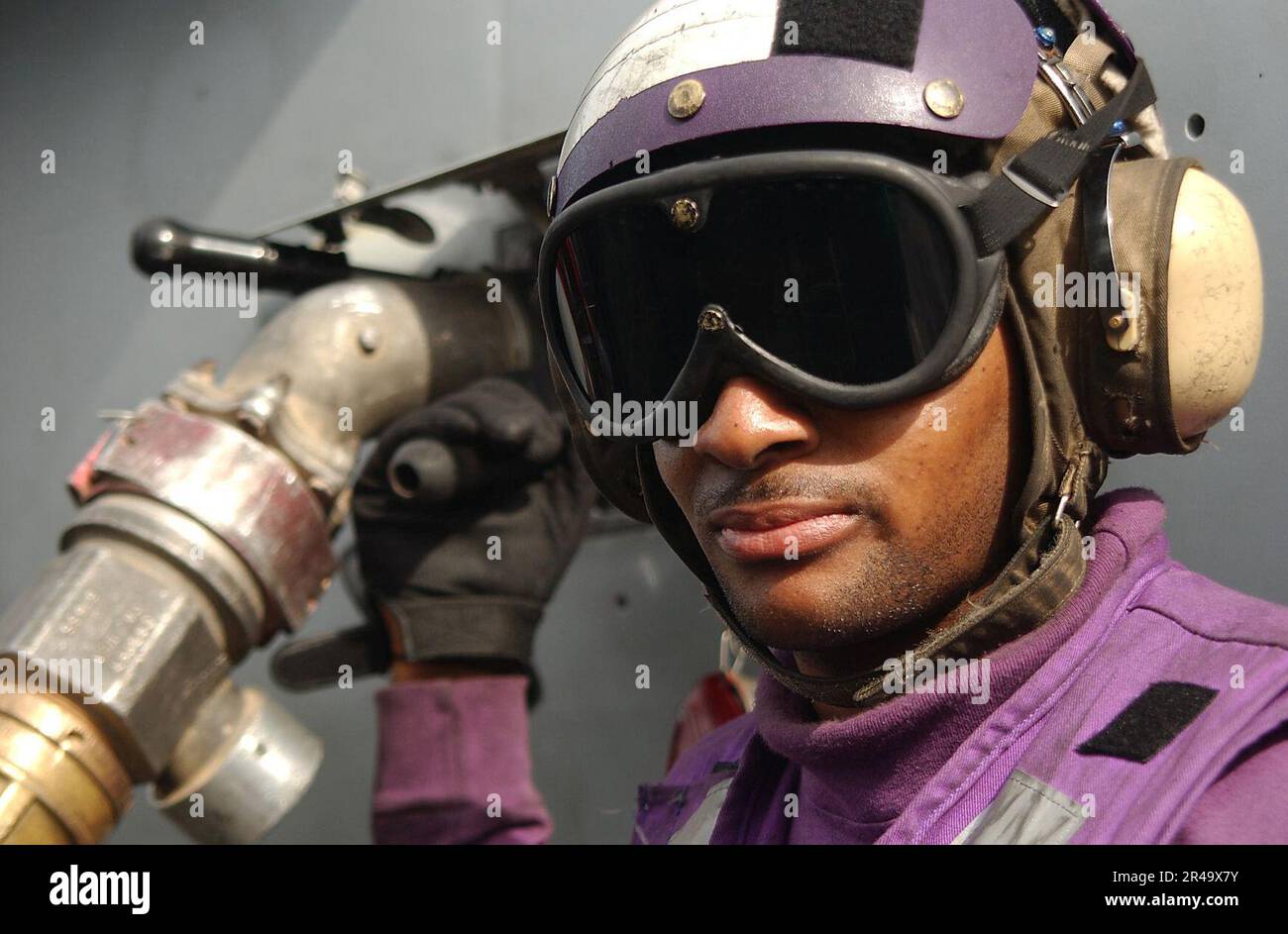US Navy Aviation Boatswain's Mate fuels an aircraft assigned to Carrier ...