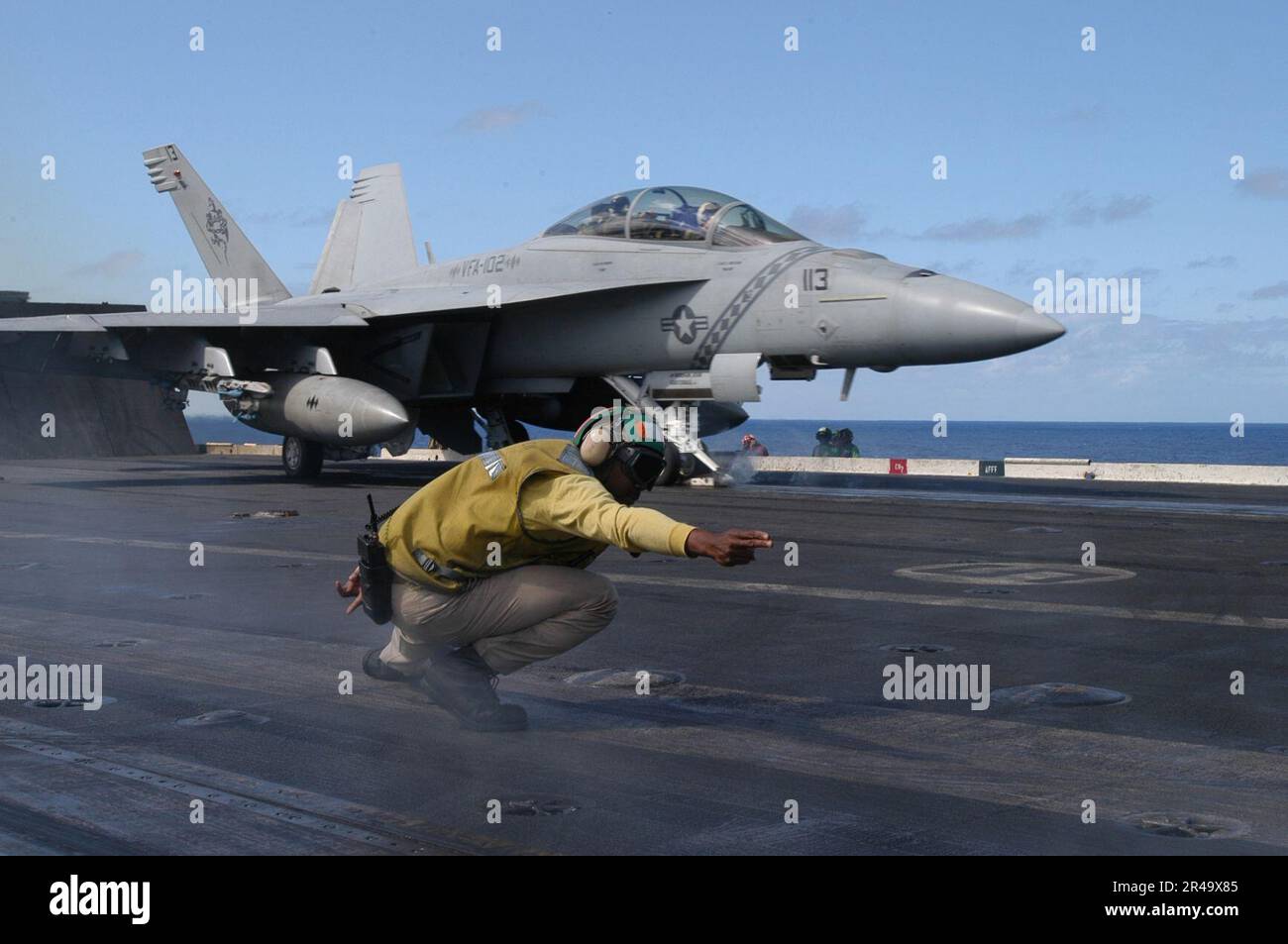 US Navy A Catapult officer signals the launch of an F-A-18F Super ...