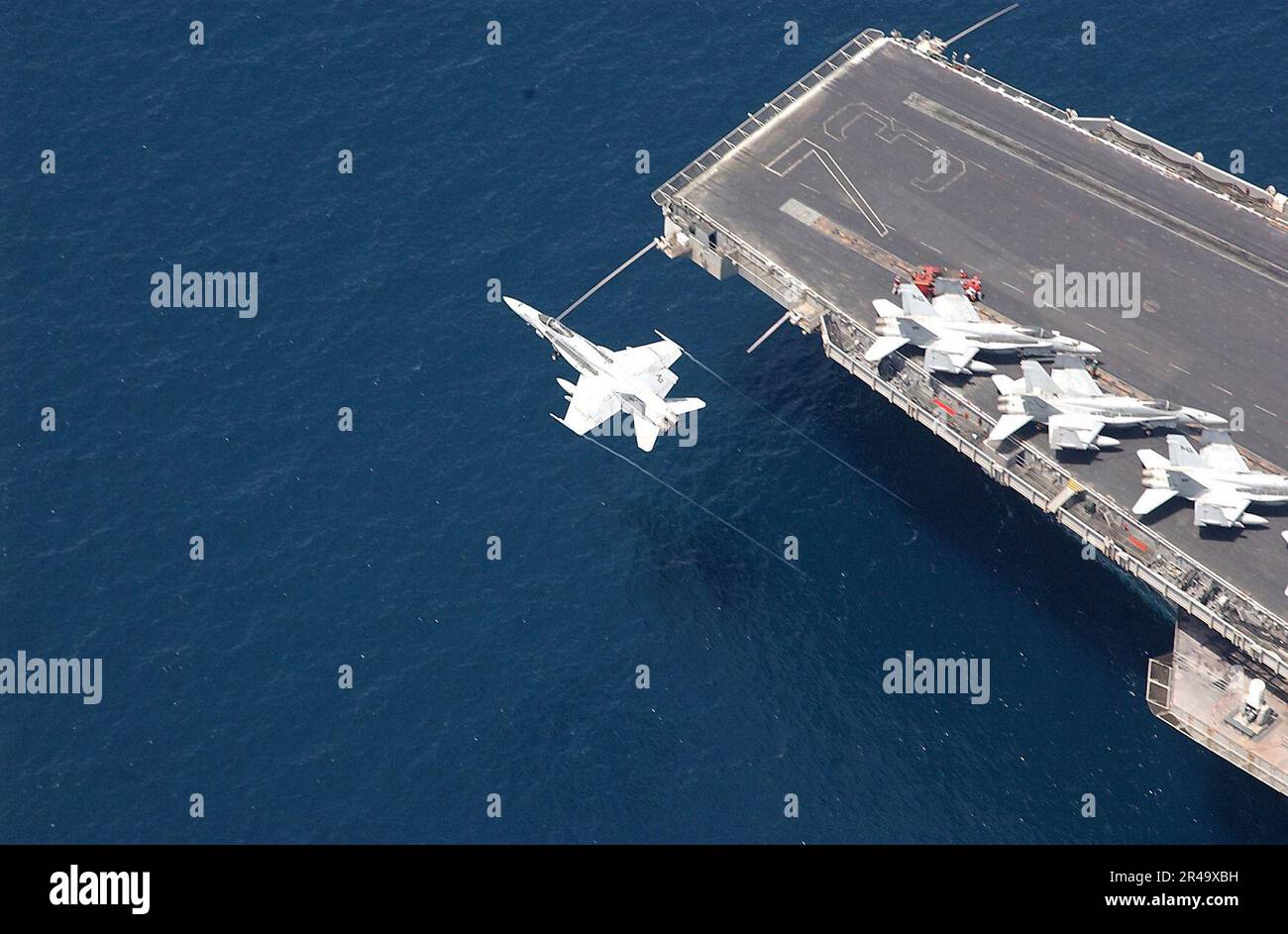 US Navy An F-A-18C Hornet launches off one of two steam-powered ...