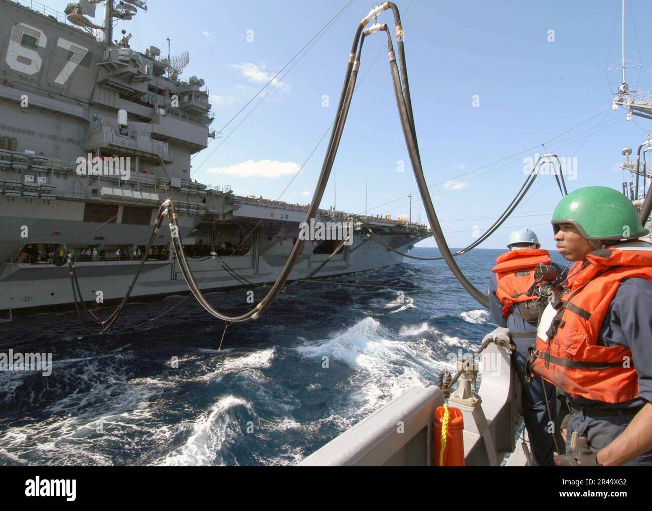 US Navy A phone talker watches as USS John F. Kennedy (CV 67), takes on ...