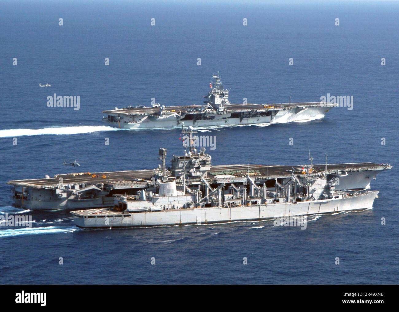 US Navy USS John F. Kennedy (CV 67) receives ordnance from the fast ...