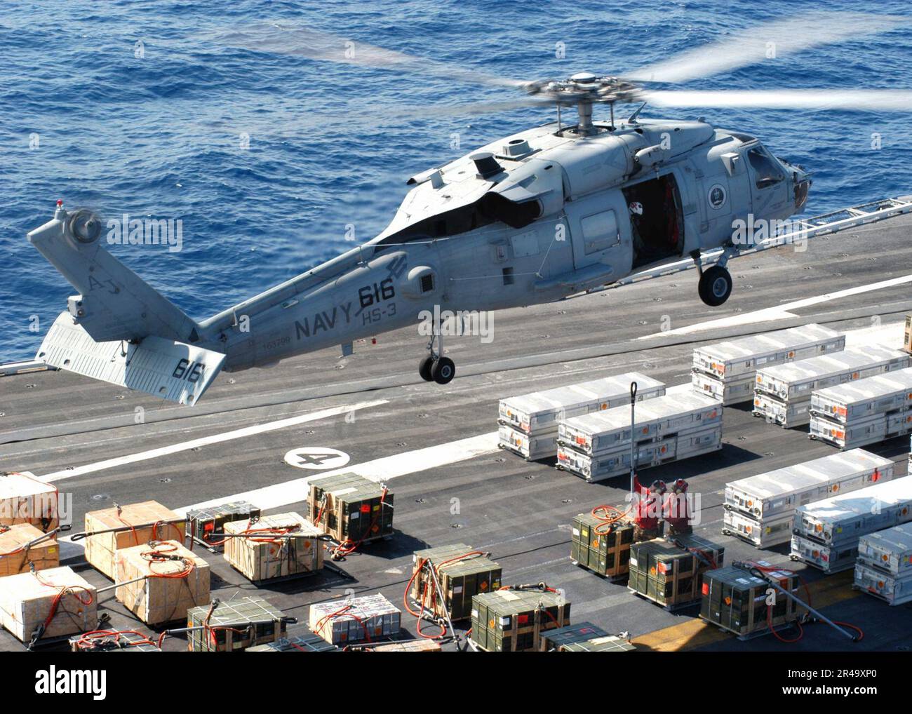 US Navy An SH-60F Seahawk hovers just above the flight deck of USS ...