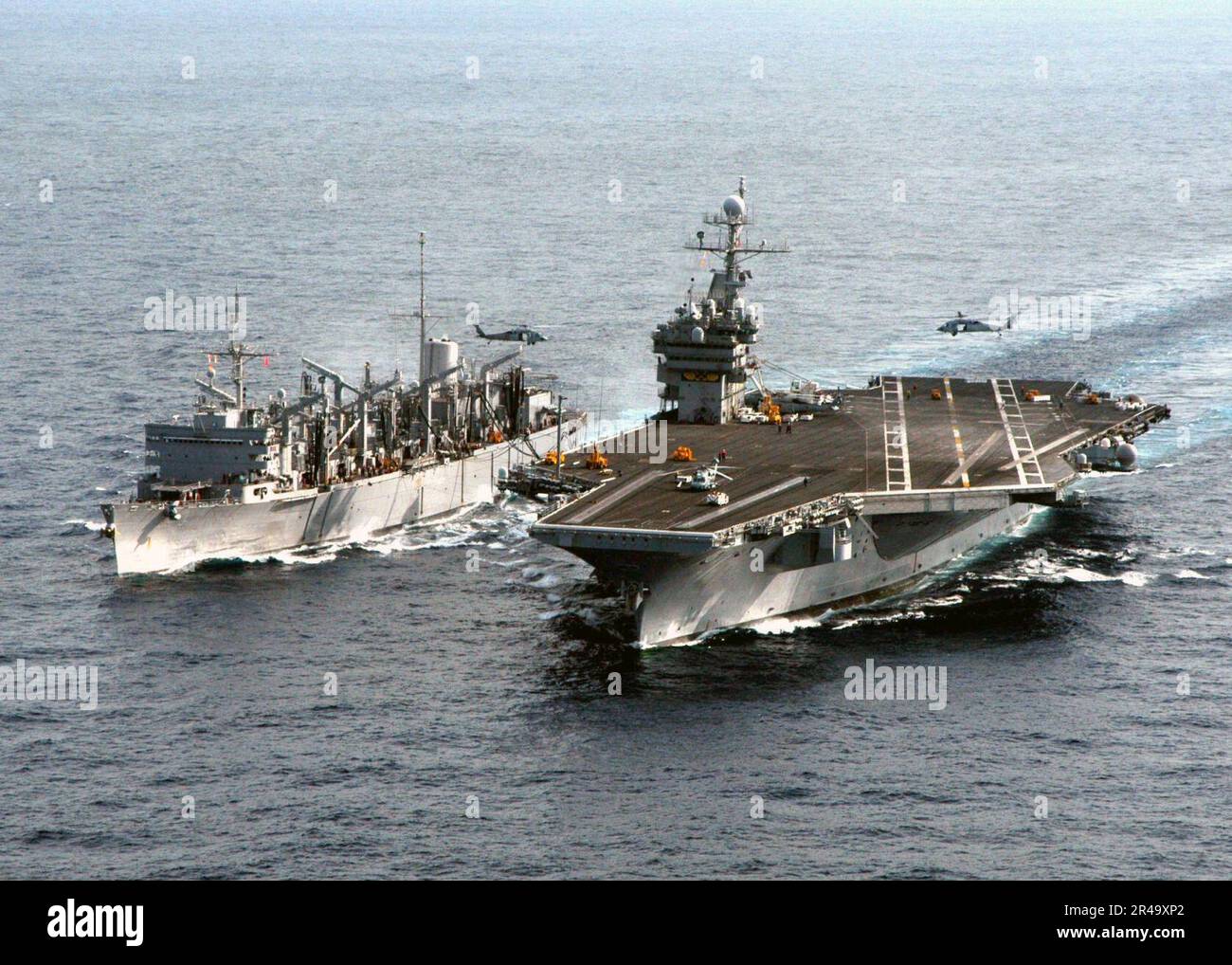 US Navy USS John F. Kennedy (CV 67) receives ordnance from the fast ...