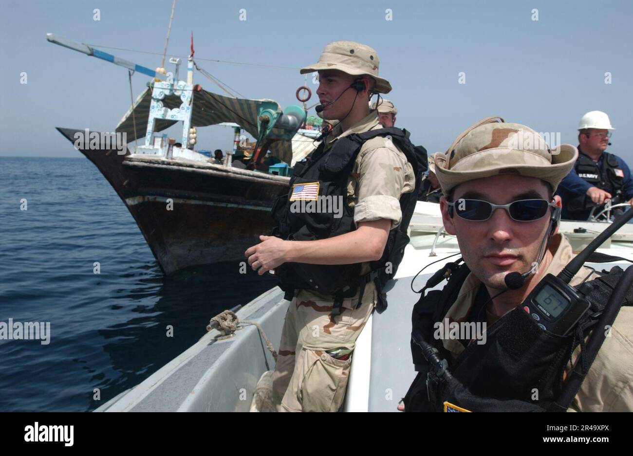 US Navy Lt. j.g. right, along with other members of a Vessel Board ...