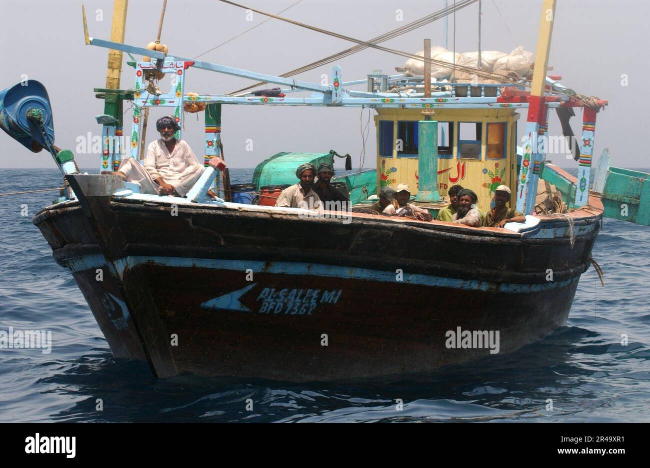 US Navy Many local fishermen aboard the small wooden dhows operating ...