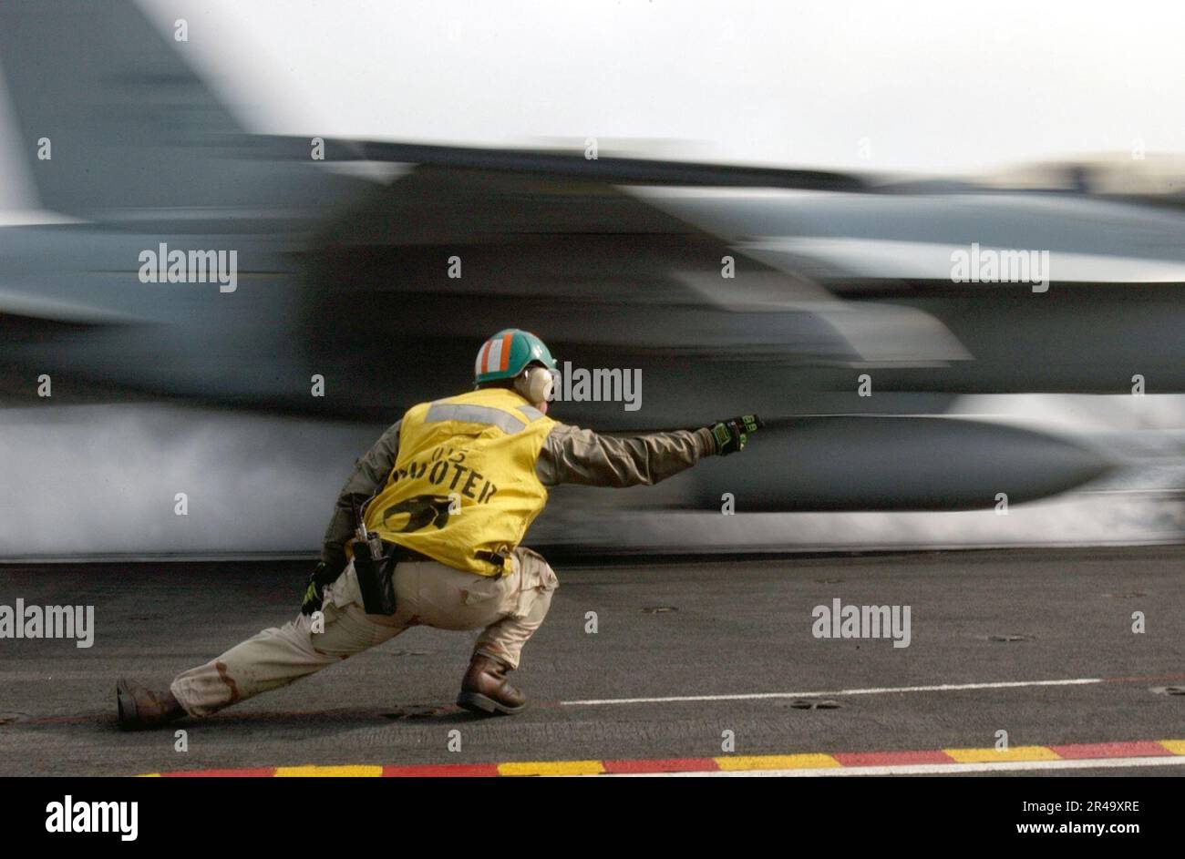 US Navy a catapult shooter, signals for the launch of an F-A-18E Super ...