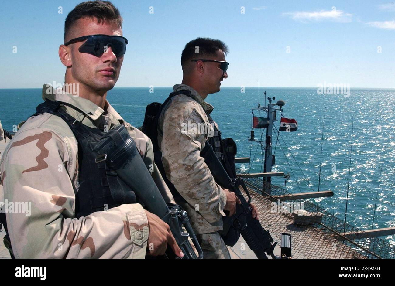 US Navy Lance Cpl. and Cpl. stand a security watch on the flight deck ...
