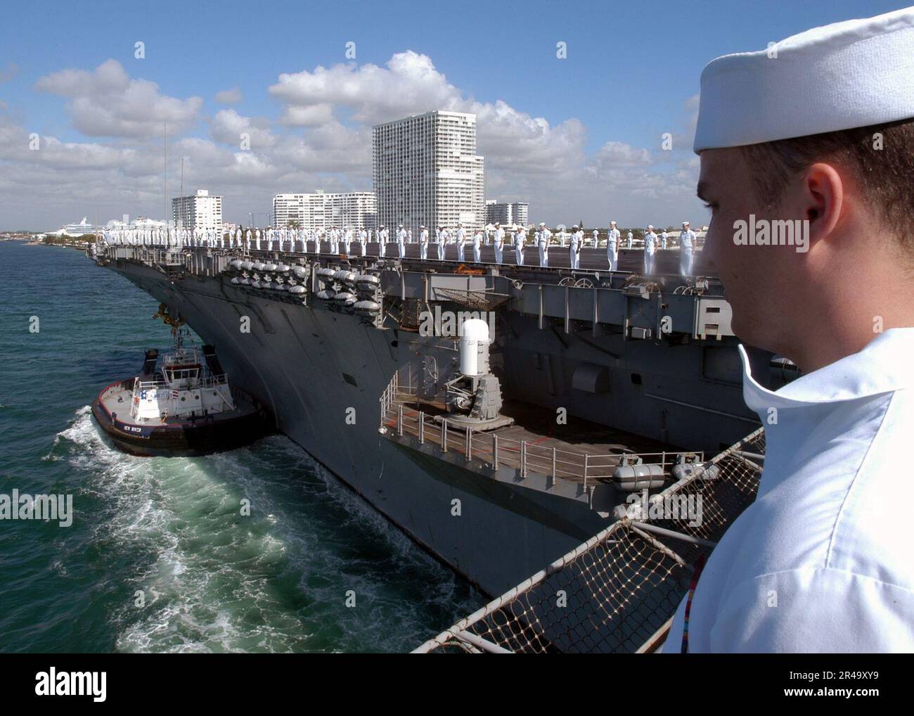 US Navy USS Enterprise (CVN-65) Sailors man the rails while commercial ...