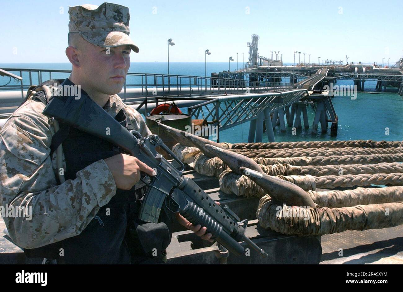 US Navy A U.S. Marine stands security watch on the deck of the Al ...